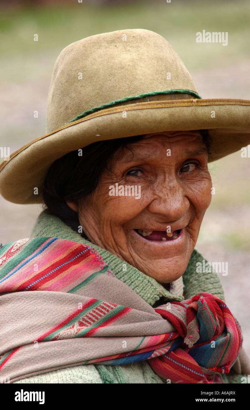An old happy Peruvian lady in the street in the ancient inca town of ...