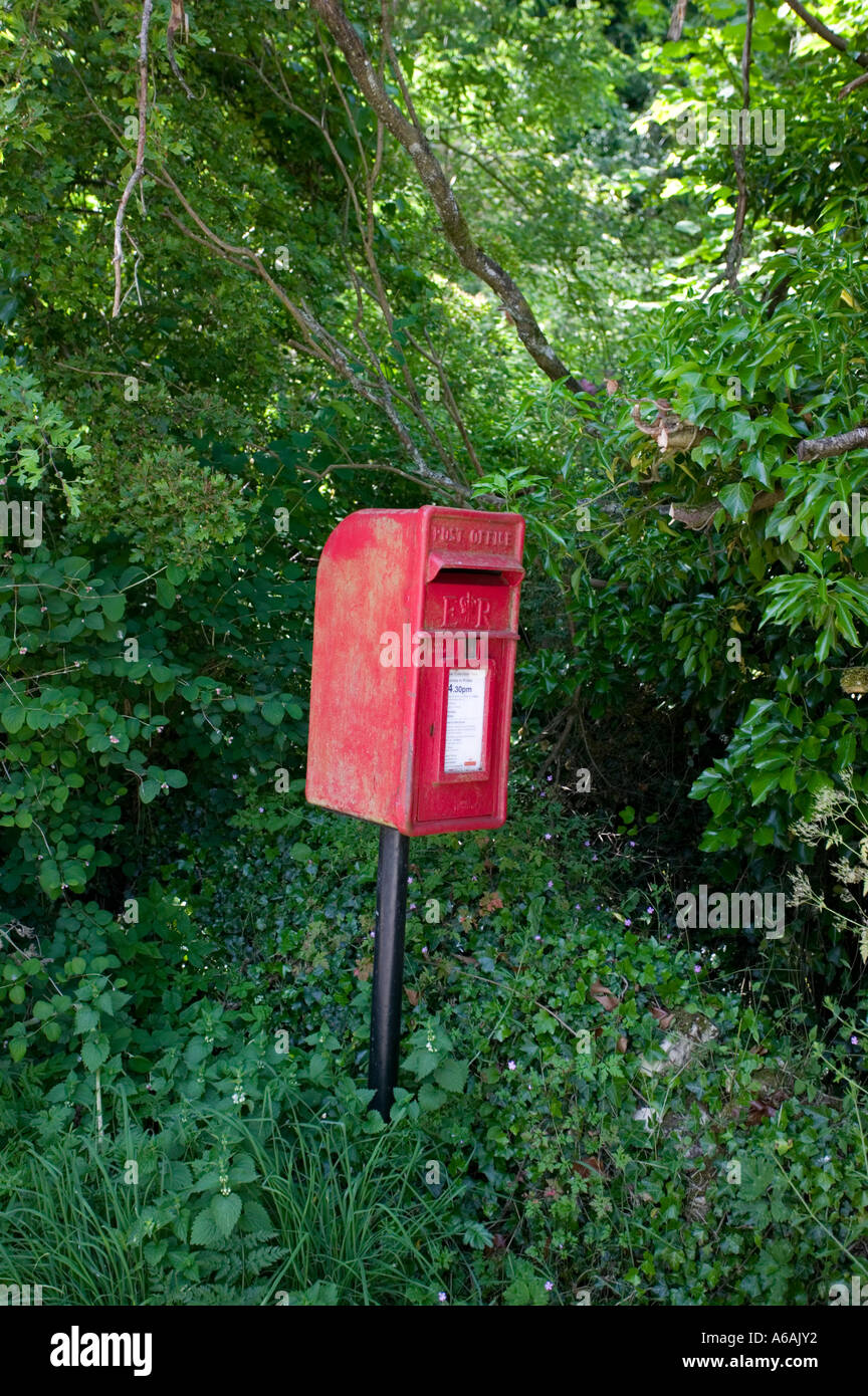 A post box amid trees in the Cotswold village of Blockley ...