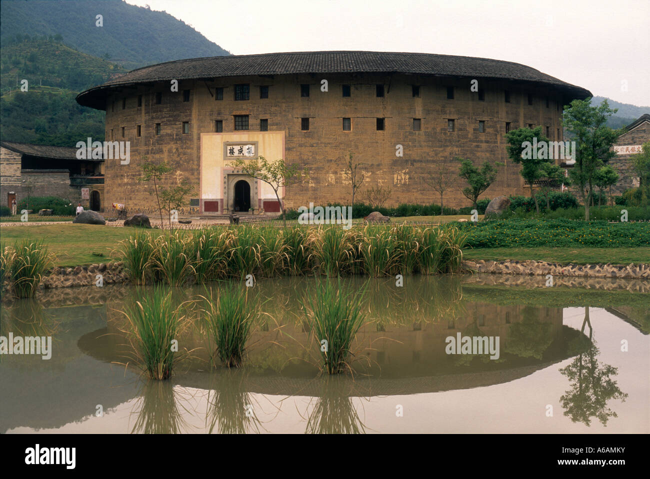 China, Fujian, Yongding, outer wall of fortress-like earthen tulou, a ...