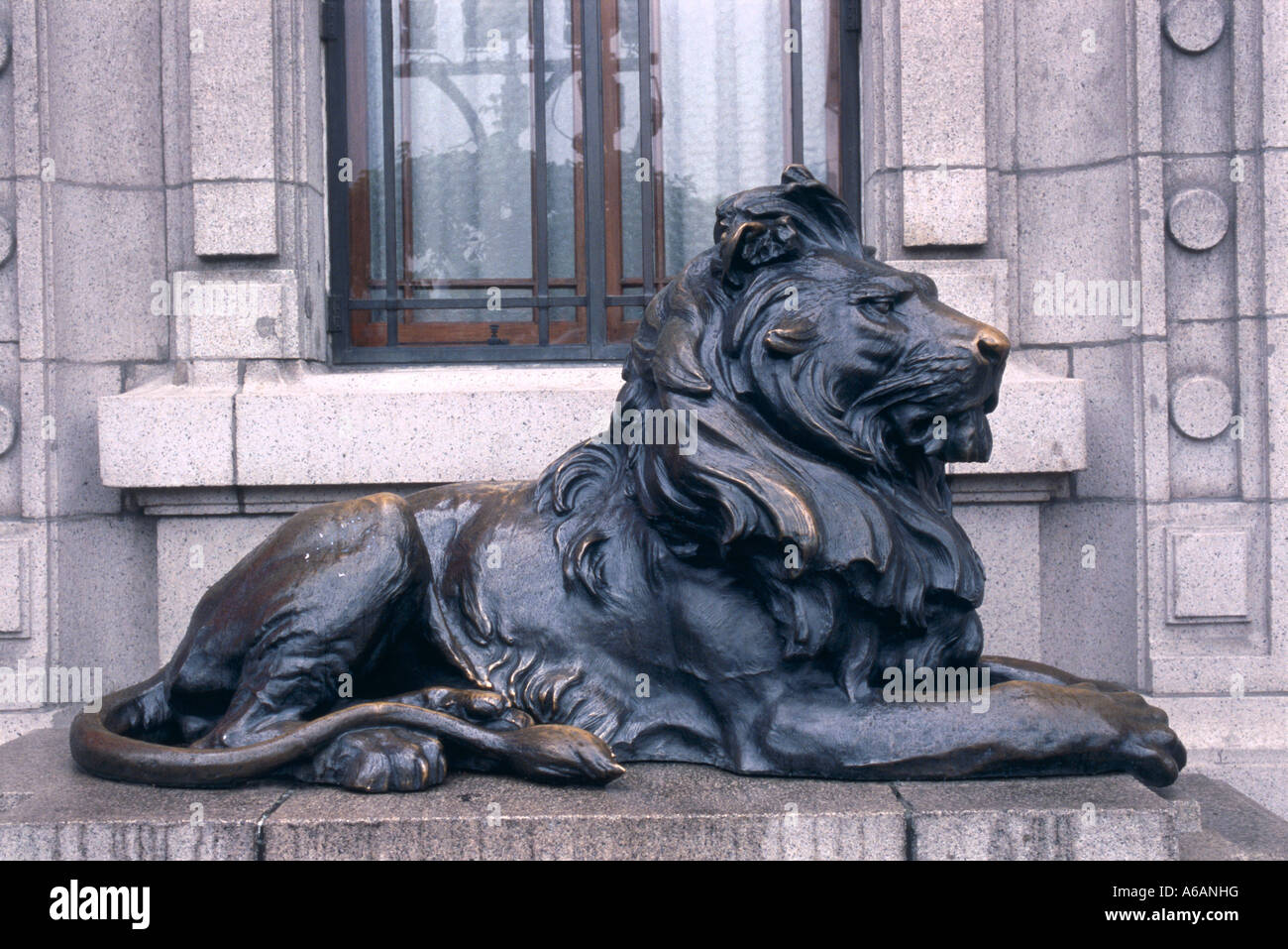 China, Shanghai, Bund, bronze statue of reclining lion, symbol of ...