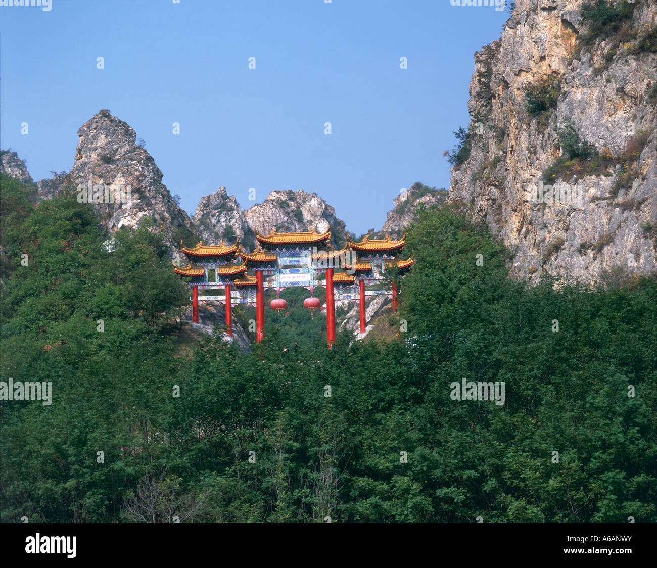 Paifang decorative archway to rugged scenery hi-res stock photography ...