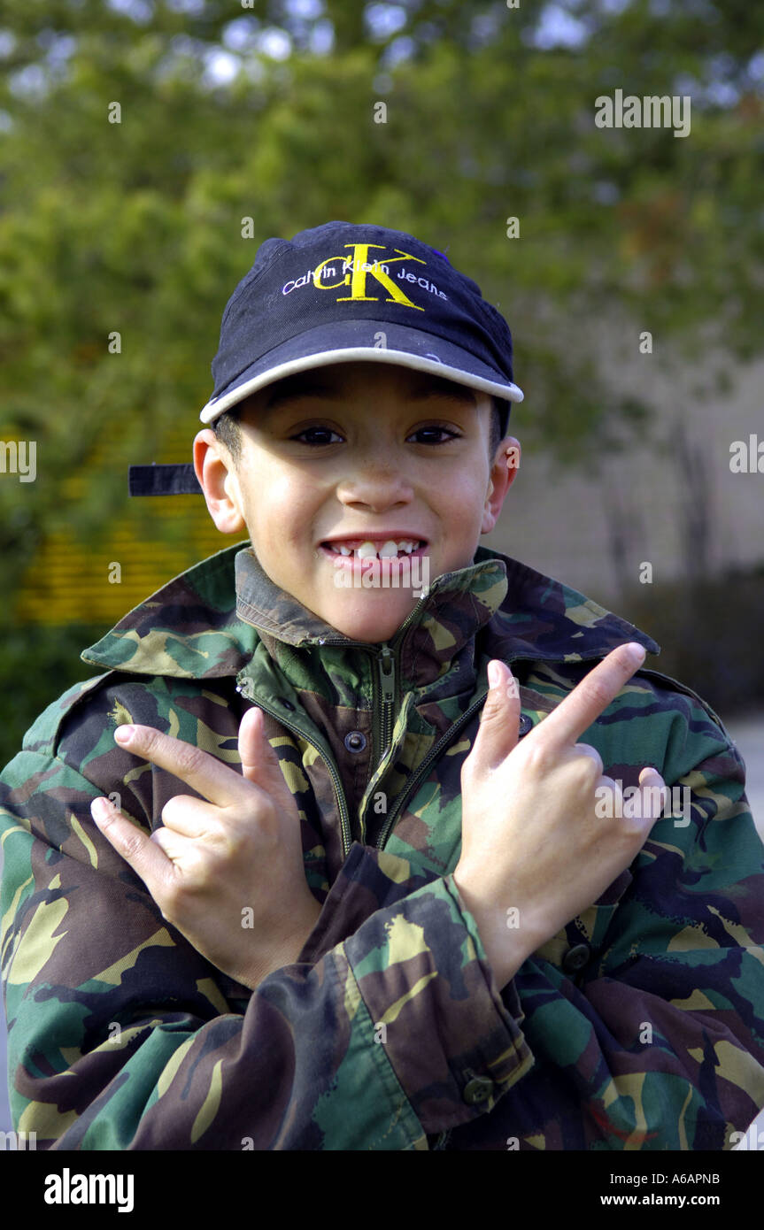 boy male kid child hat baseball cap signs hands gestures vertical ...