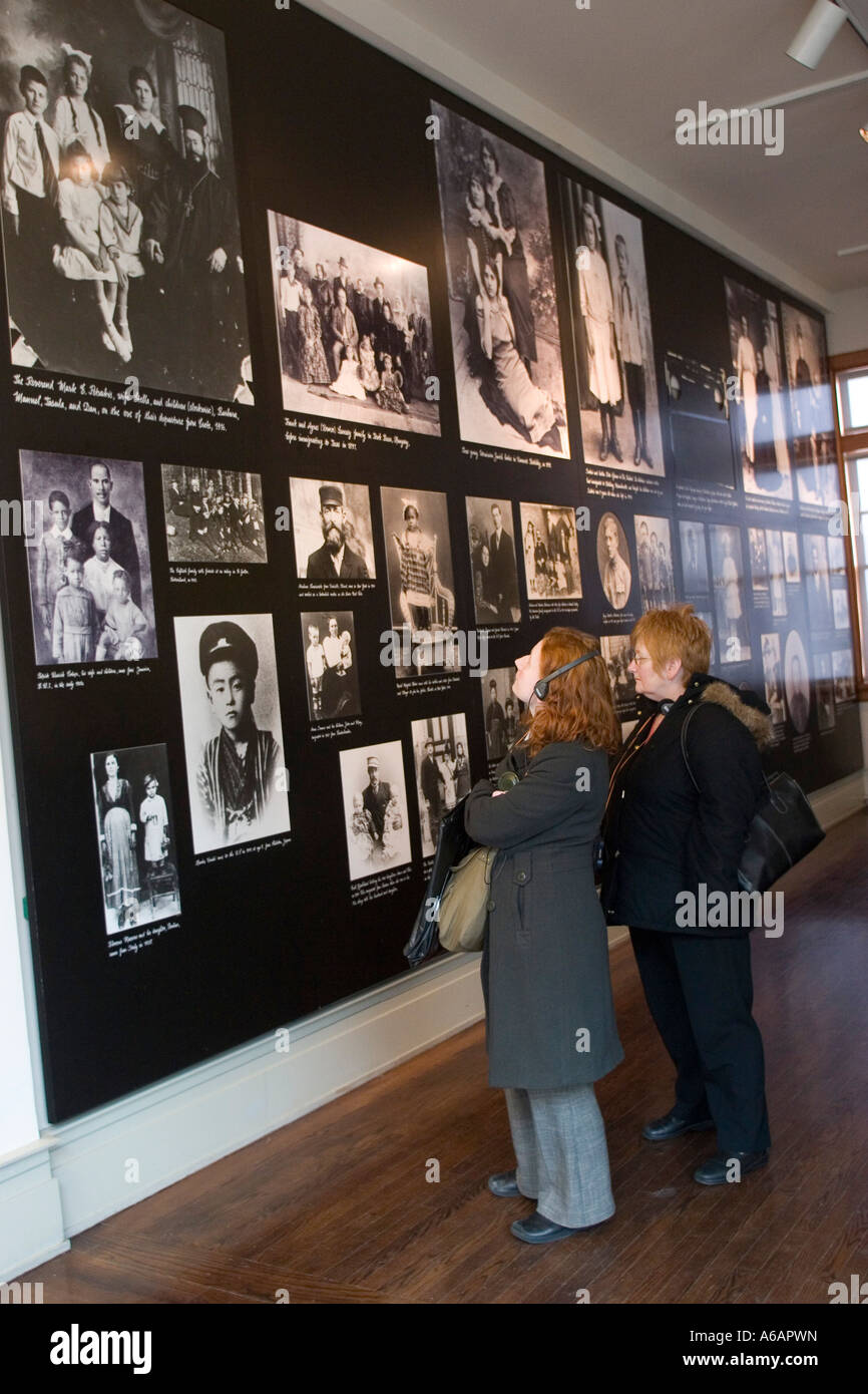 Tourists viewing Photo wall Ellis Island Immigration Centre New York ...