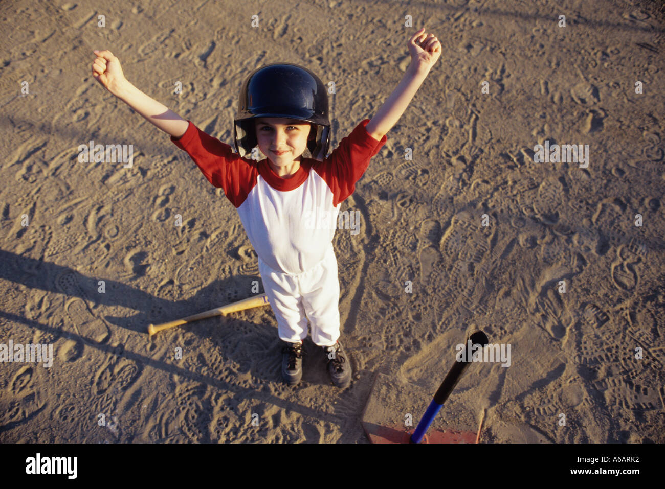 Young girl 7 celebrating after getting winning hit T ball smiling proud ...