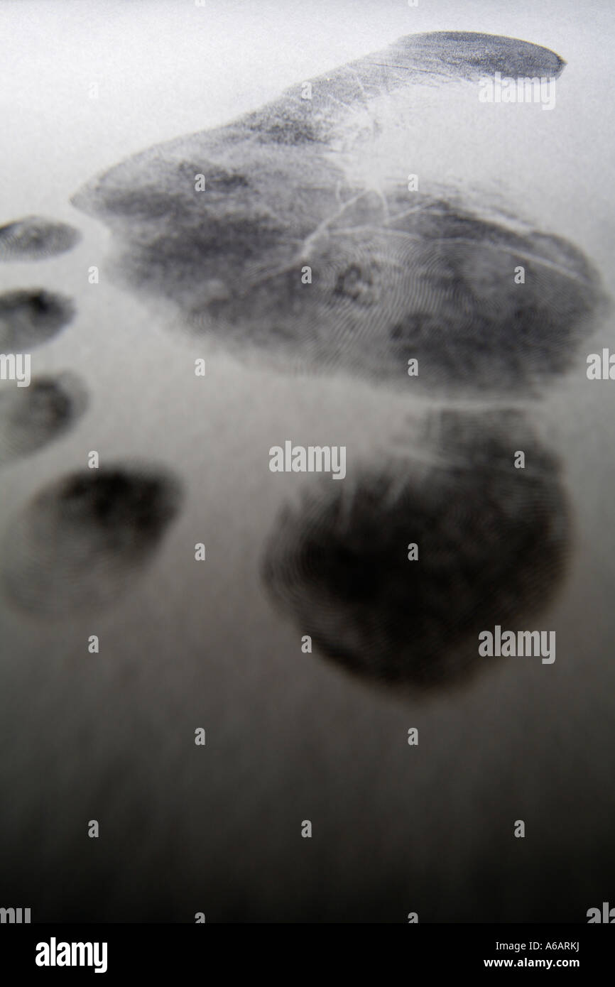 black and white image of a single footprint with toe prints in ...