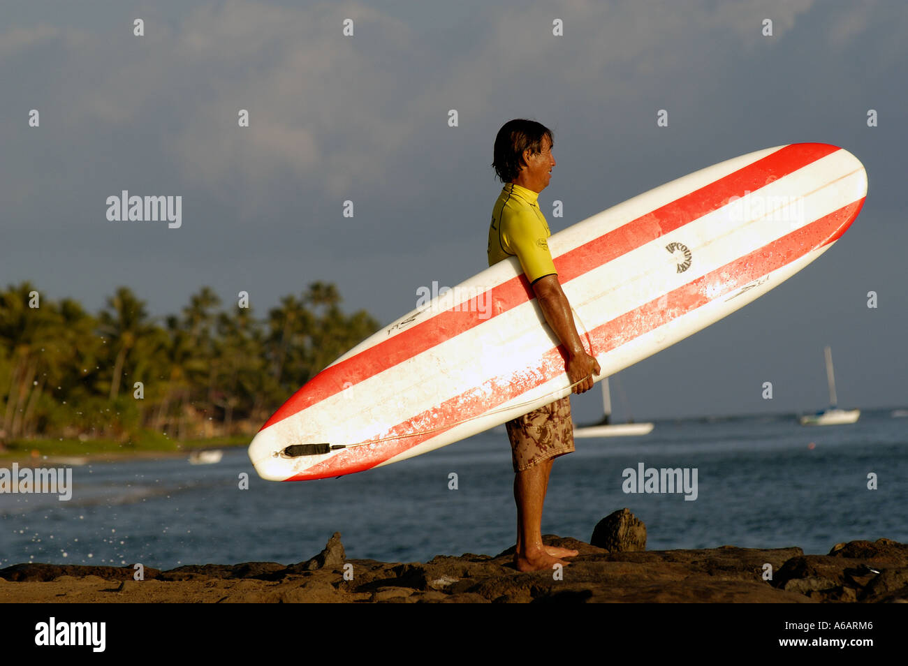 Man standing surf board watching lahaina hi-res stock photography and ...