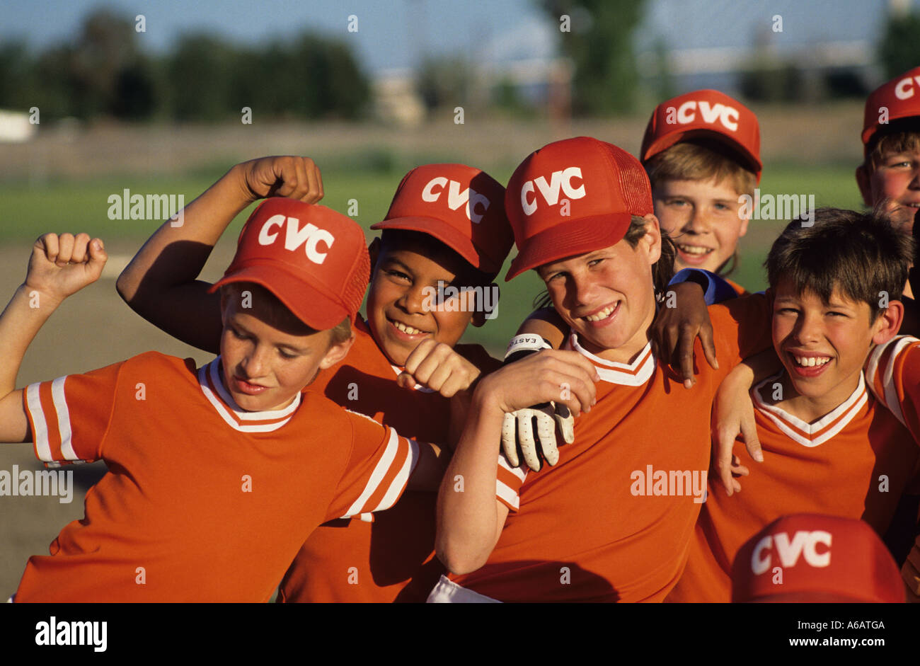 Little league baseball team group portrait after game, sunset light ...