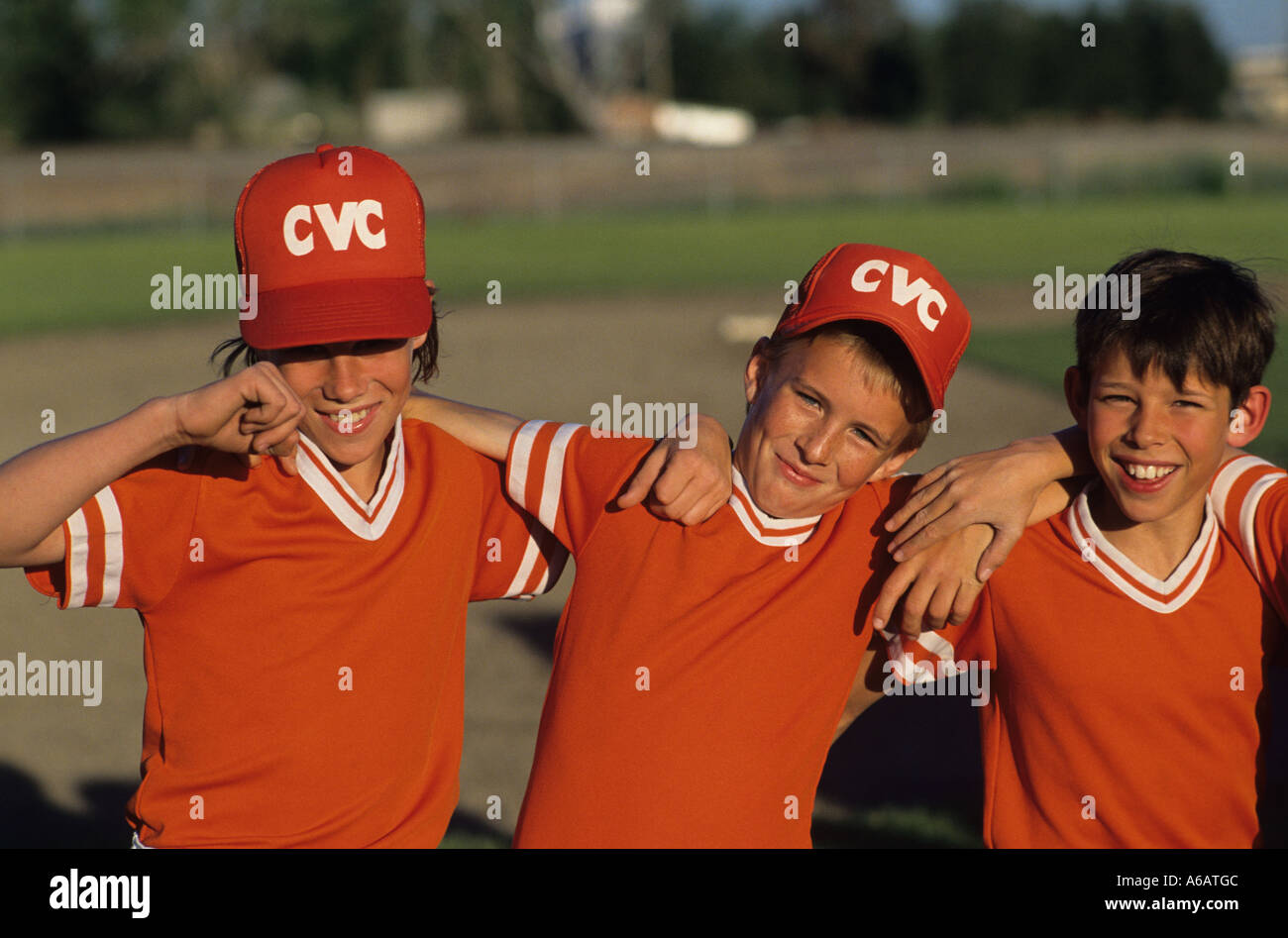 Little league baseball team group portrait after game, sunset light ...