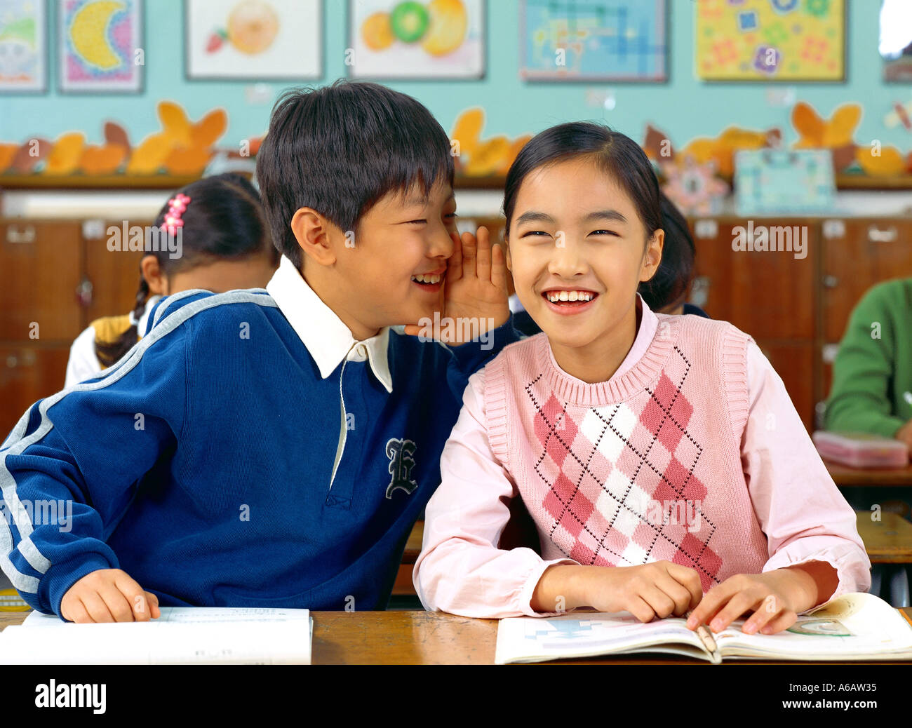 Students whispering classroom hi-res stock photography and images - Alamy