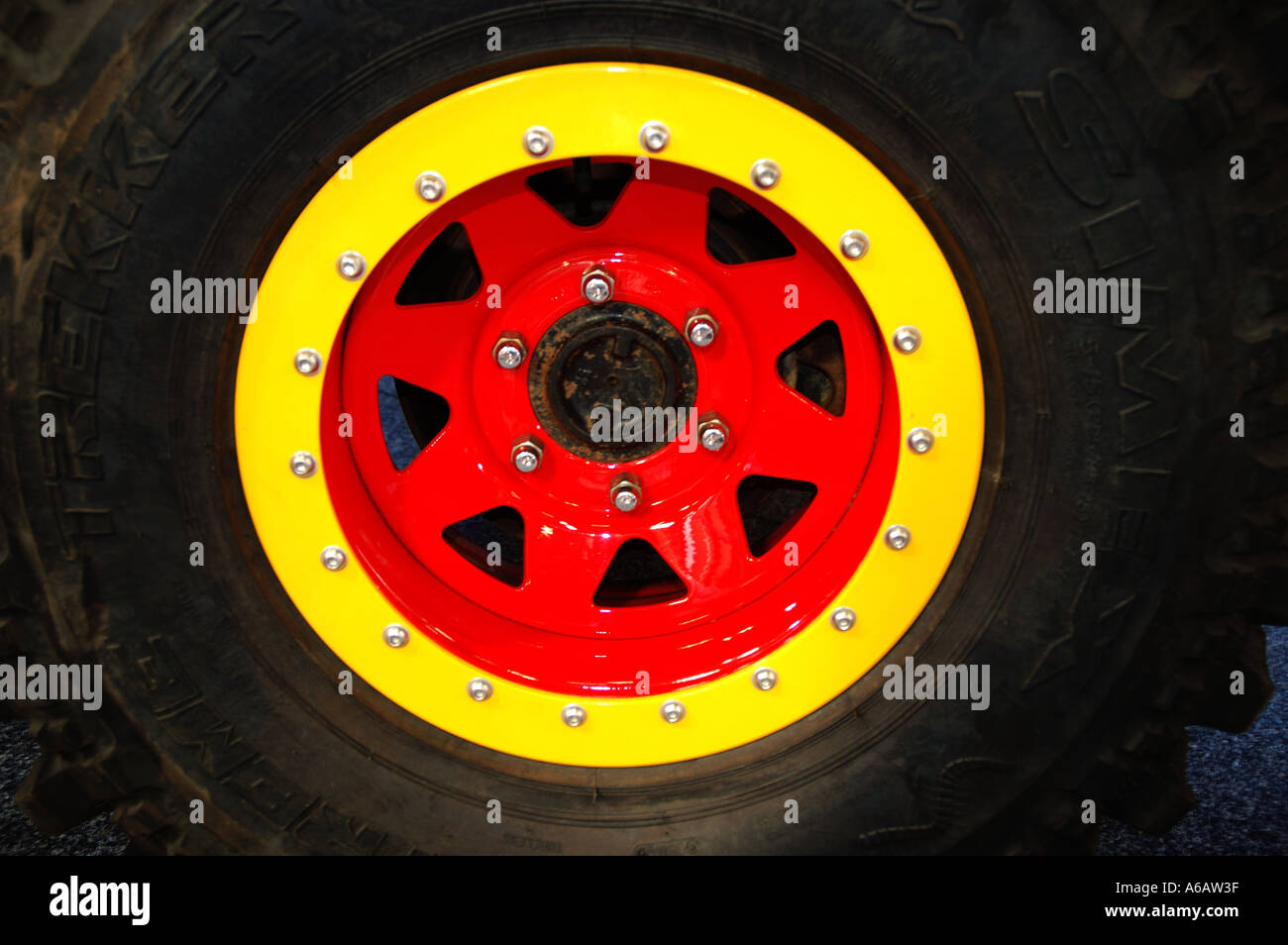 bright steel spoked wheel on custom 4 wheel drive SUV Stock Photo - Alamy