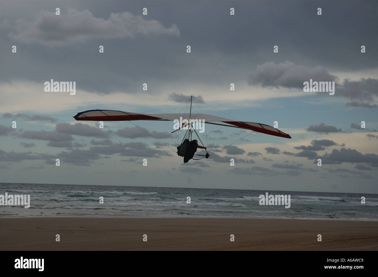 Hang glider approching for beach landing Noosa Queensland Australia ...