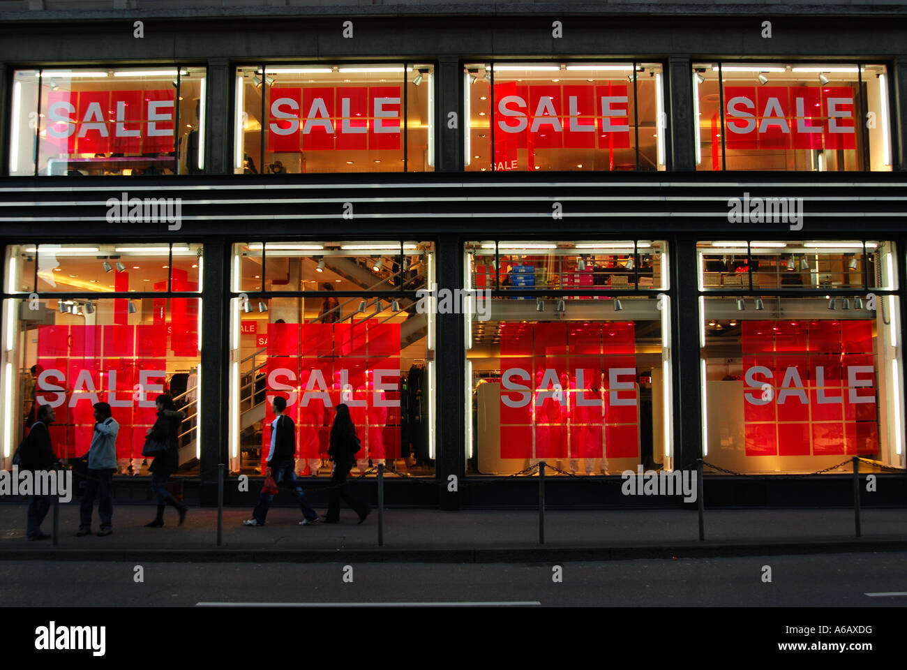 Sale signs in shop window Stock Photo - Alamy