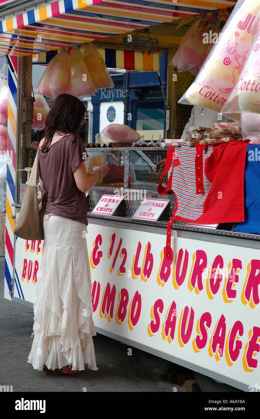 Young woman at fairground kiosk Stock Photo - Alamy