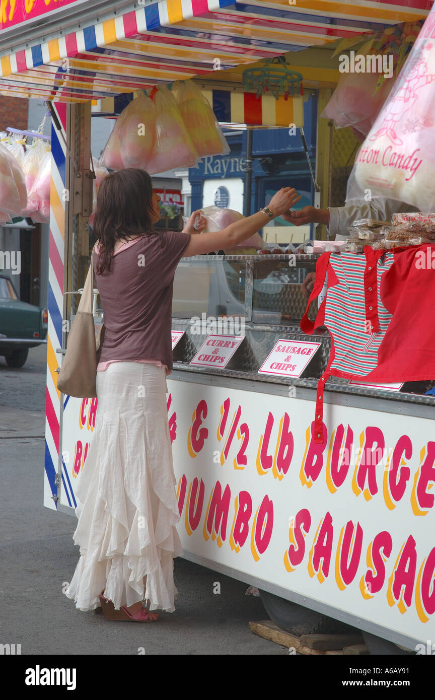 Young woman at fairground kiosk Stock Photo - Alamy