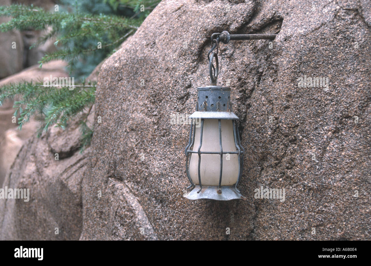 lamp lantern on a rock hanging paraffin kerosene lamp Stock Photo - Alamy