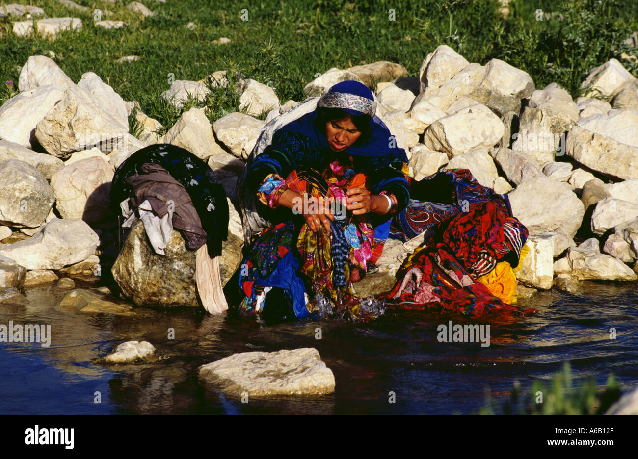 iran nomad nomad woman washing her clothes in a river brook nomadic ...