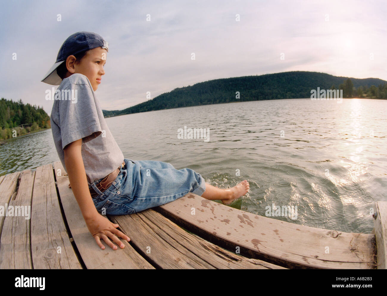 Seven year old boy on dock at St Mary s Lake Saltspring Island BC ...