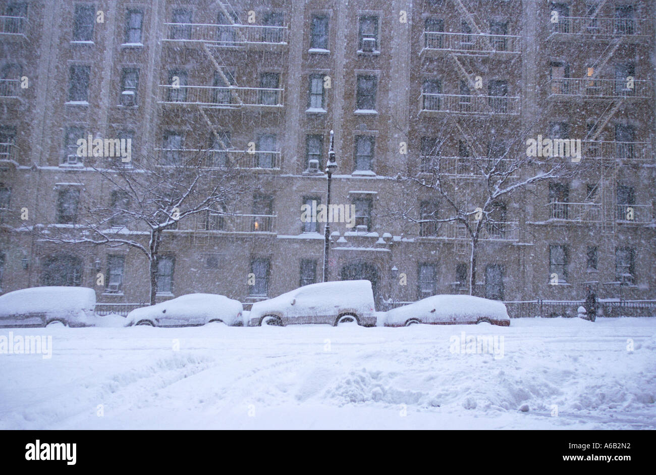 New York City tenement buildings in a snowstorm. Deserted street no ...