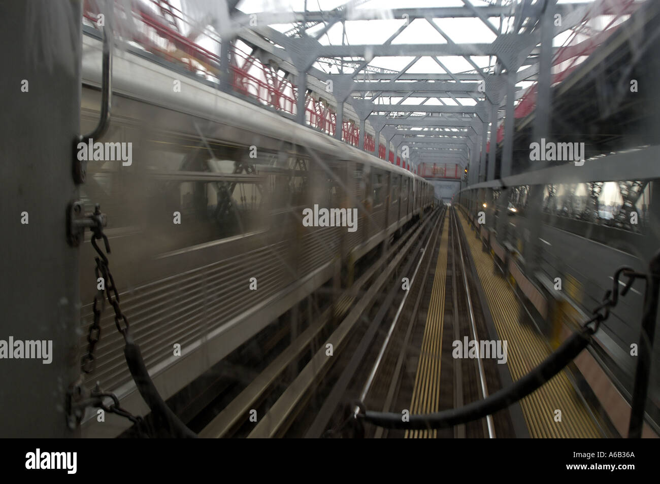 Williamsburg Subway bridge grid metal pillars commuters train station metro NY struts horizontal ...