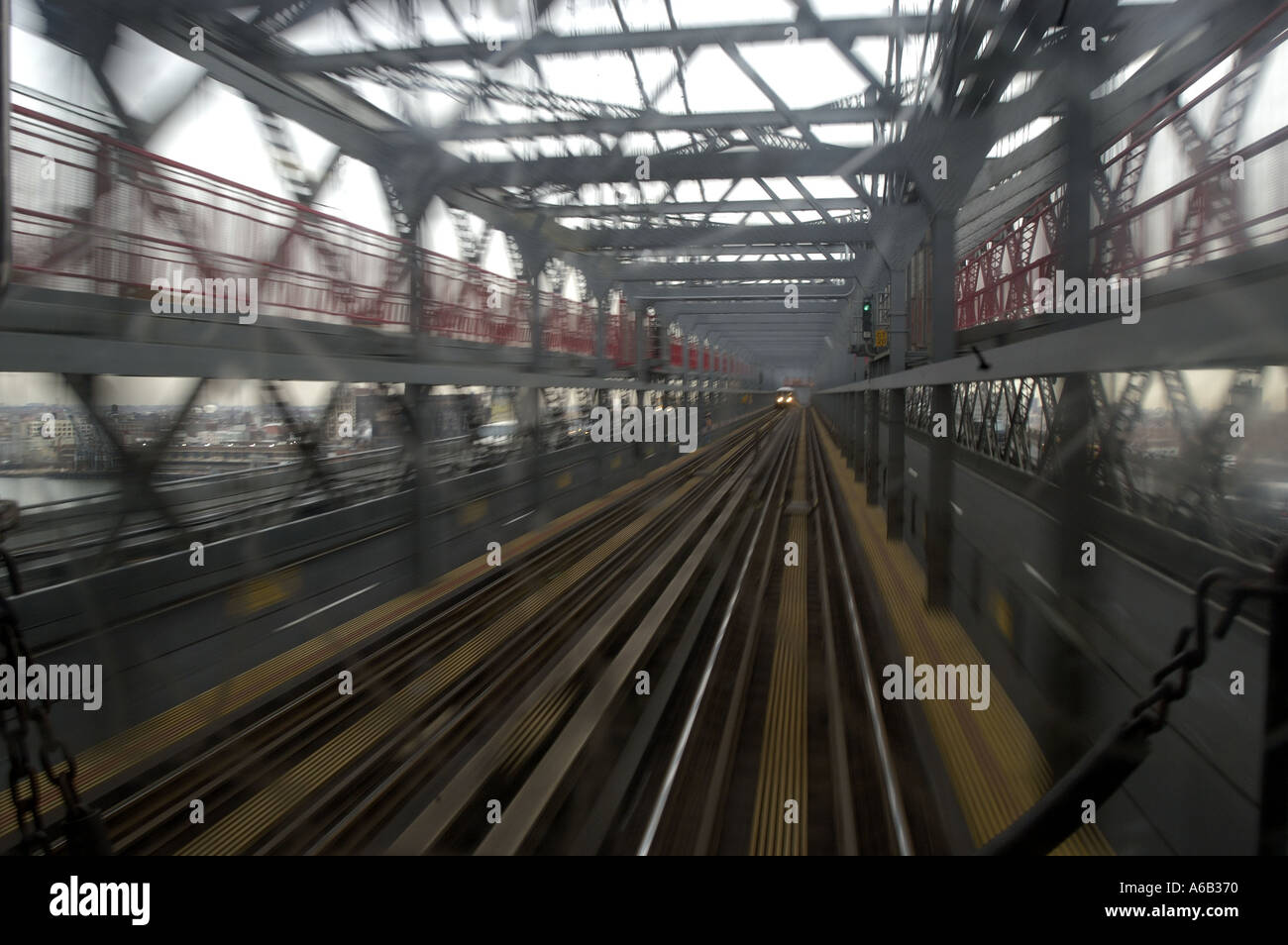 Williamsburg Subway bridge grid metal pillars commuters train station metro NY struts horizontal ...