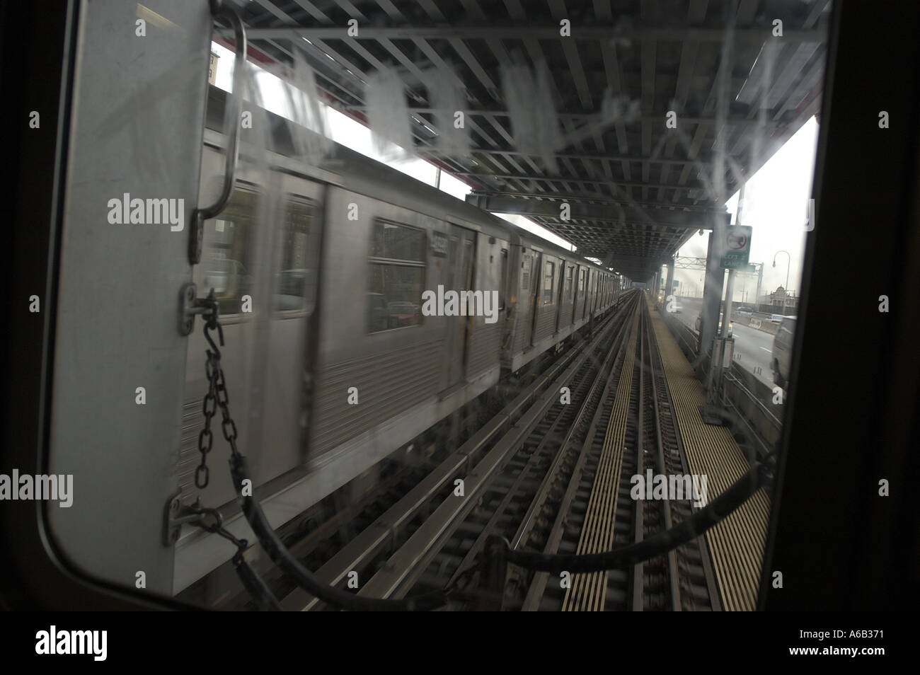 Williamsburg Subway bridge grid metal pillars commuters train station metro NY struts window ...