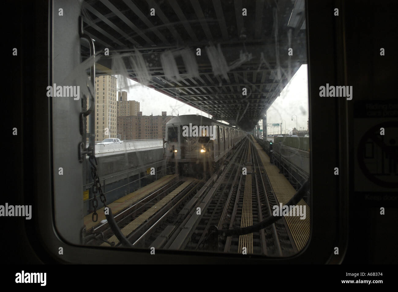 Williamsburg Subway bridge grid metal pillars commuters train station metro NY struts window ...