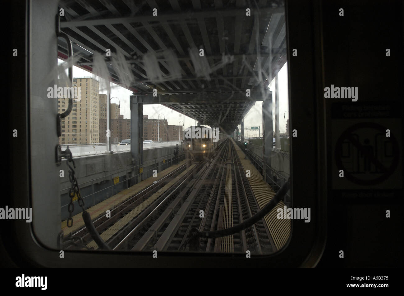 Williamsburg Subway bridge grid metal pillars commuters train station metro NY struts window ...