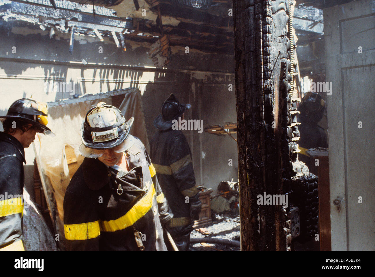 Fire firemen destruction residential house interior. Firefighter ...