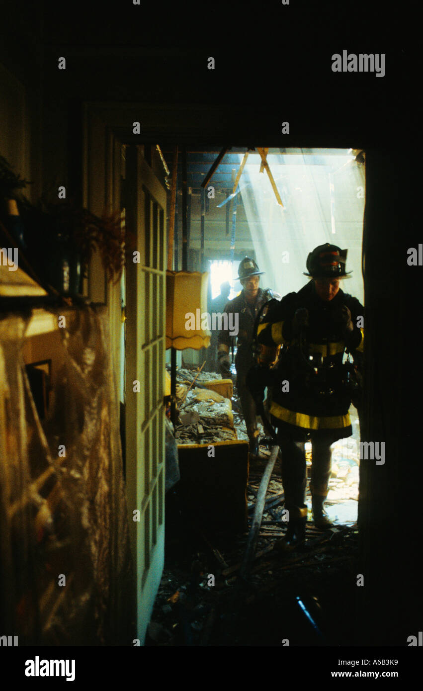 Firemen inspecting devastation inside of burning building The Bronx ...