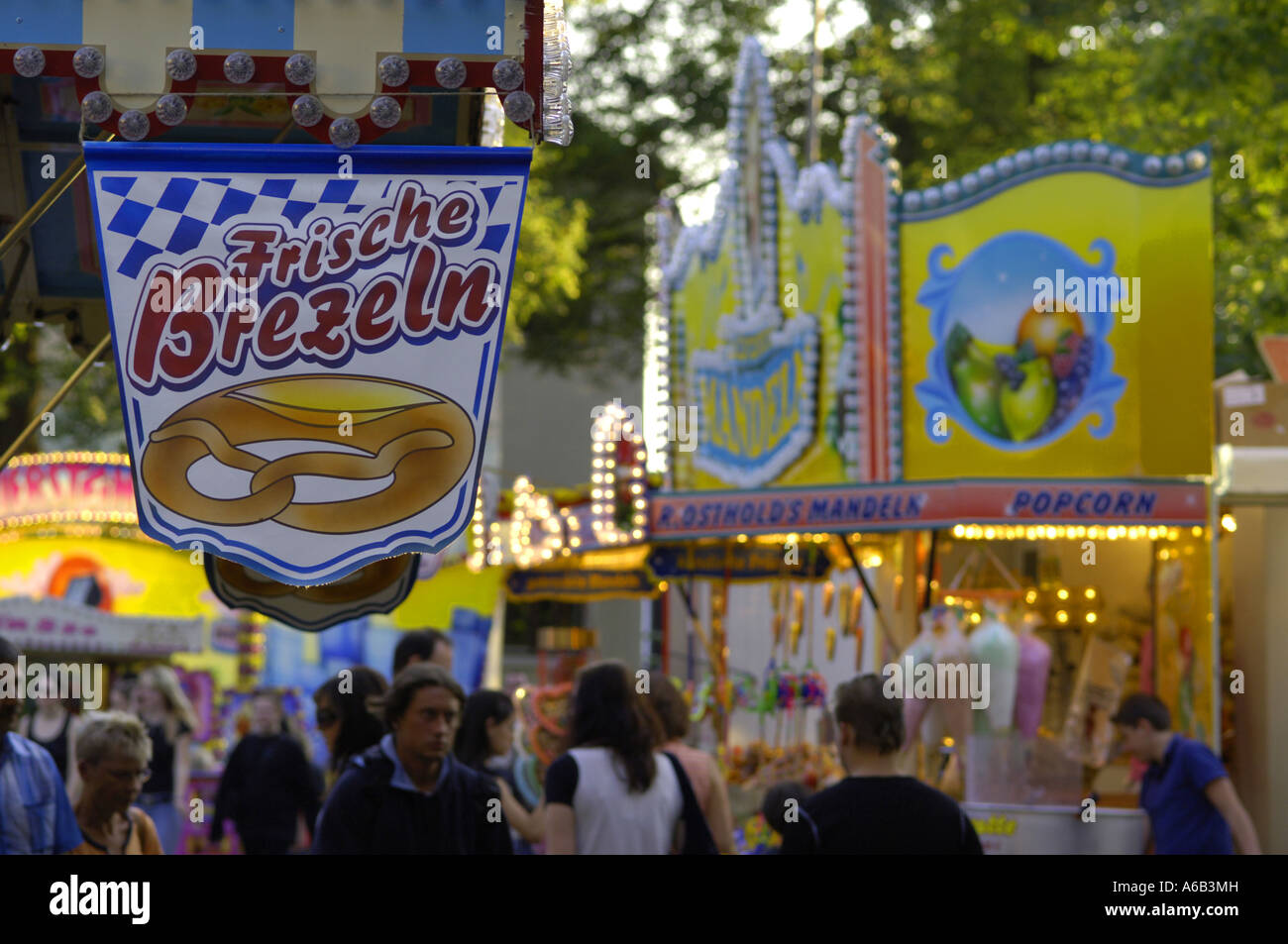 german german festival market stalls people brezeln fresh bread funfair ...
