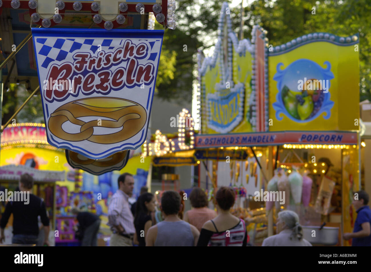 german german festival market stalls people brezeln fresh bread funfair ...