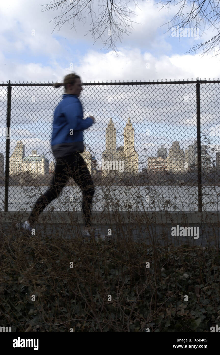 Jogger running alongside the Central Park Reservoir Stock Photo - Alamy