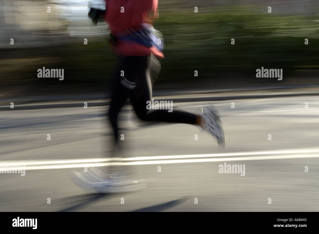 Jogger running alongside the Central Park Reservoir Stock Photo - Alamy