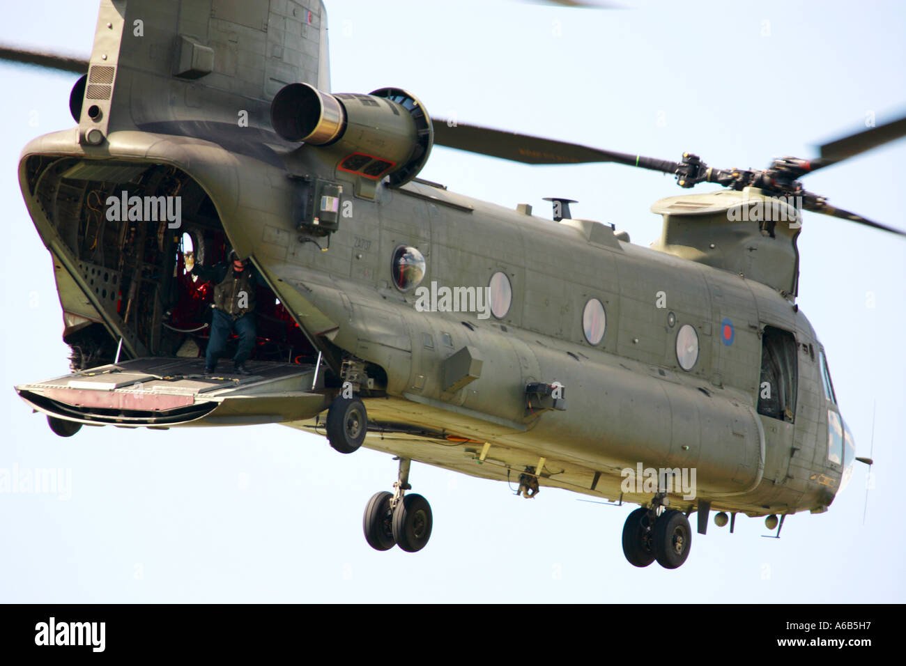 Boeing Chinook heavy helicopter with navel personnel looking out of ...