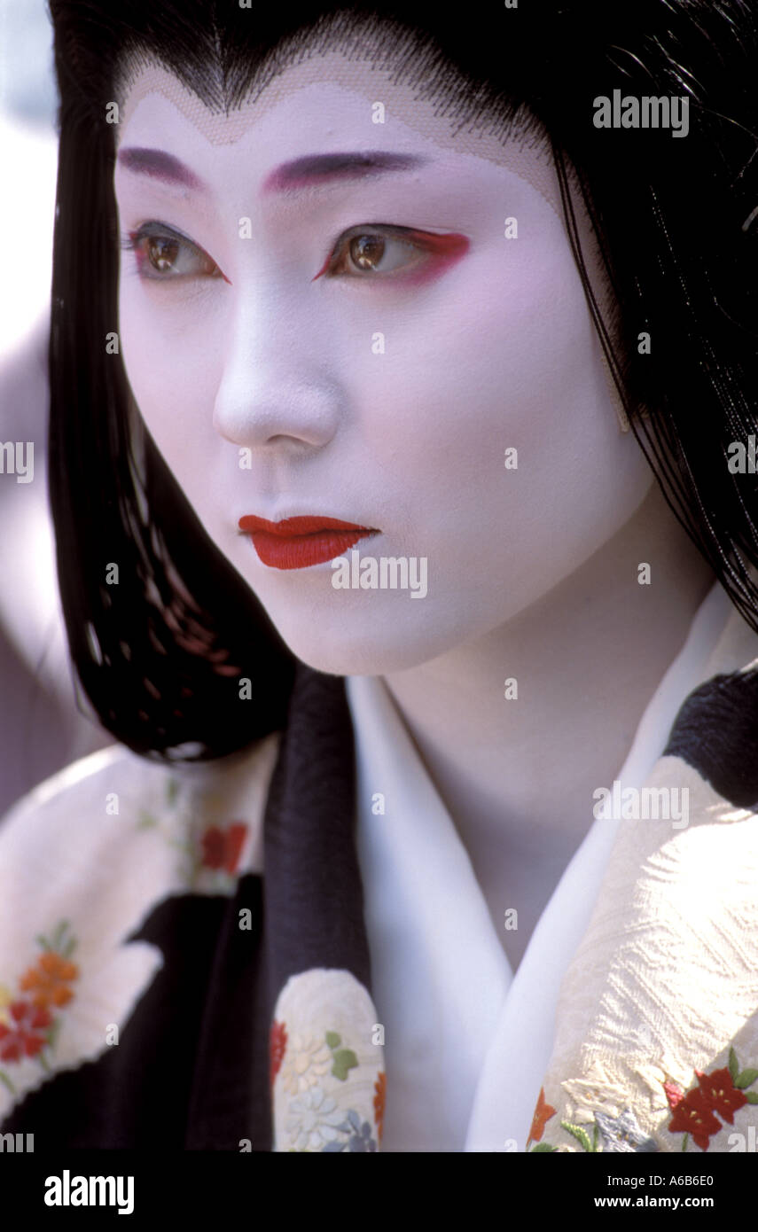 A beautiful woman in white face makeup and a wig partakes in the Jidai ...
