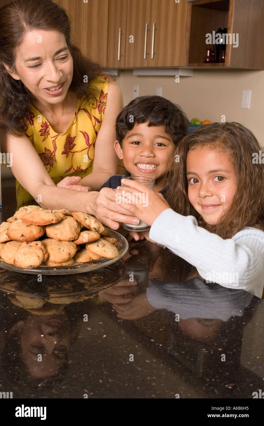 Portrait of mom and kids with cookies Stock Photo - Alamy