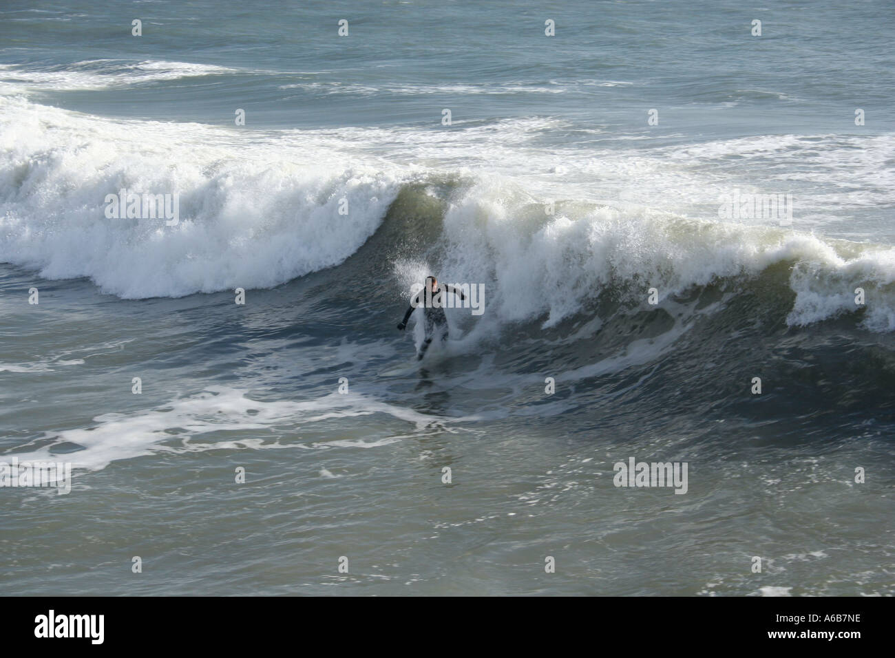 Surf Boarder riding a wave at Bournemouth, Dorset, UK. Europe Stock ...