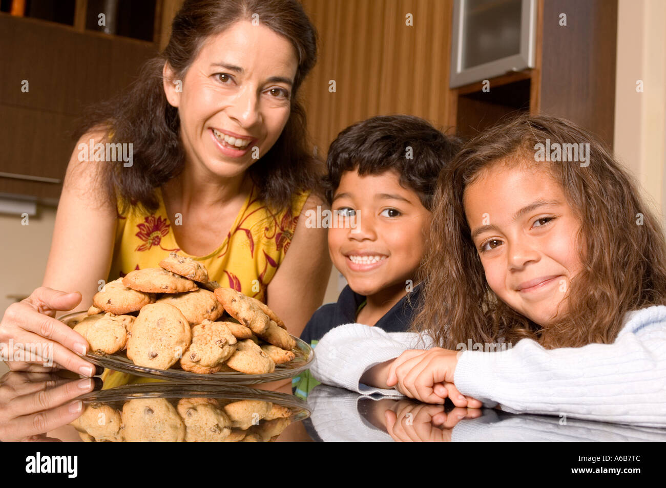 Portrait of mom and kids with cookies Stock Photo - Alamy