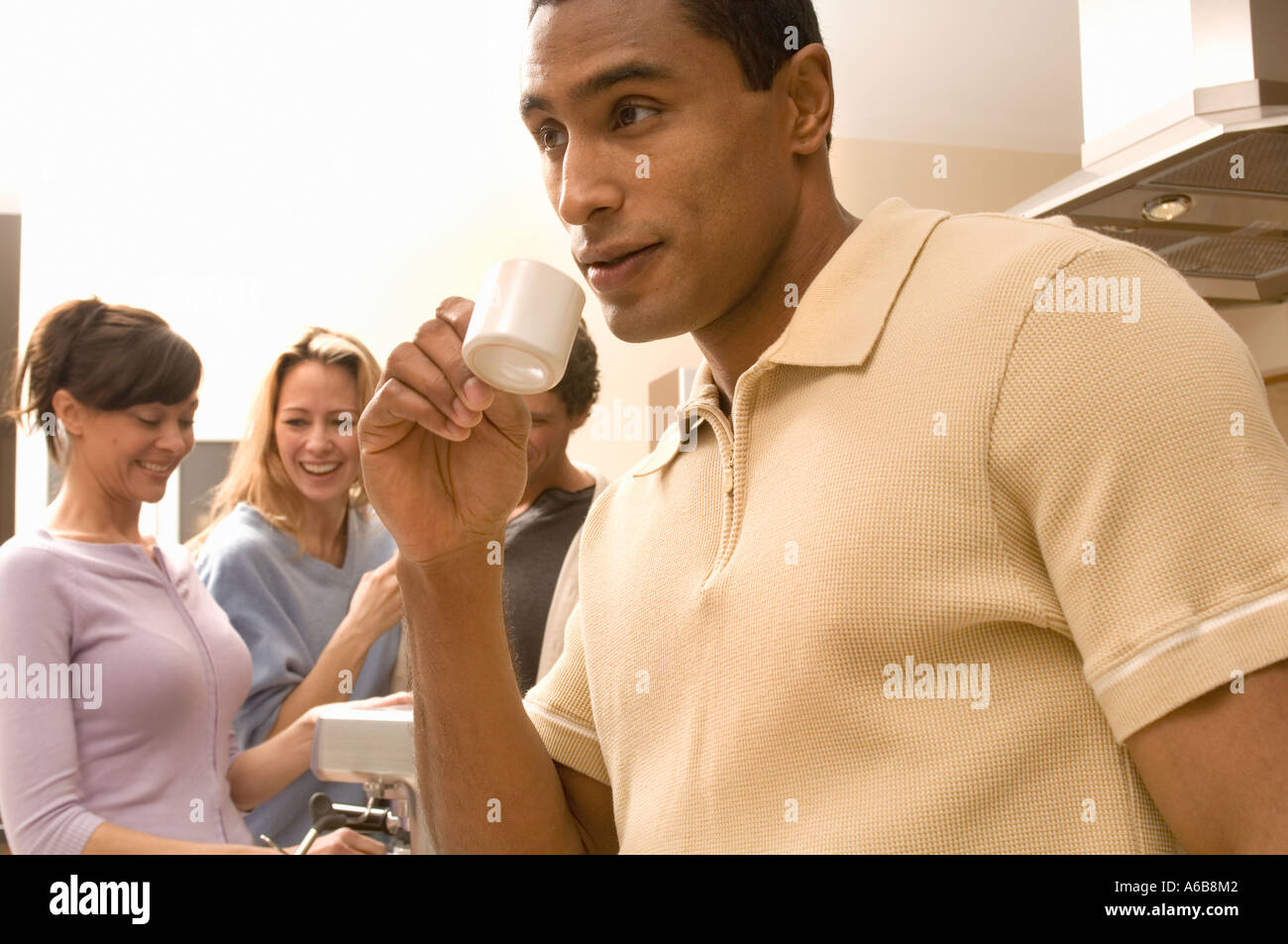 Group of adults drinking coffee Stock Photo - Alamy