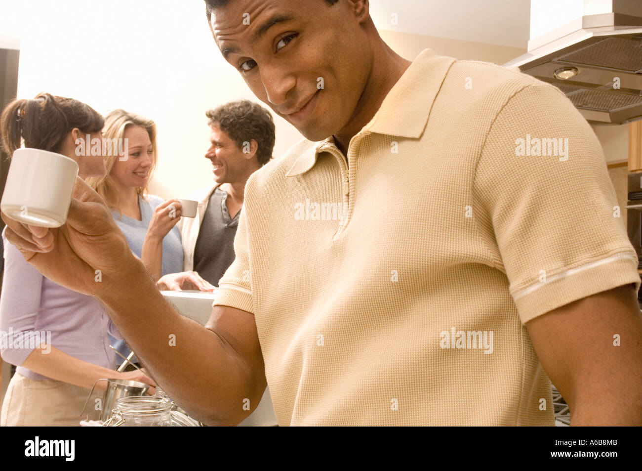 Group of adults drinking coffee Stock Photo - Alamy