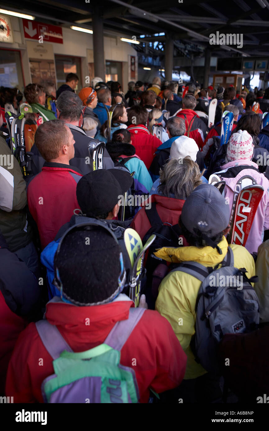 Skiers queueing for the ski lifts in Zermatt Switzerland Europe ...
