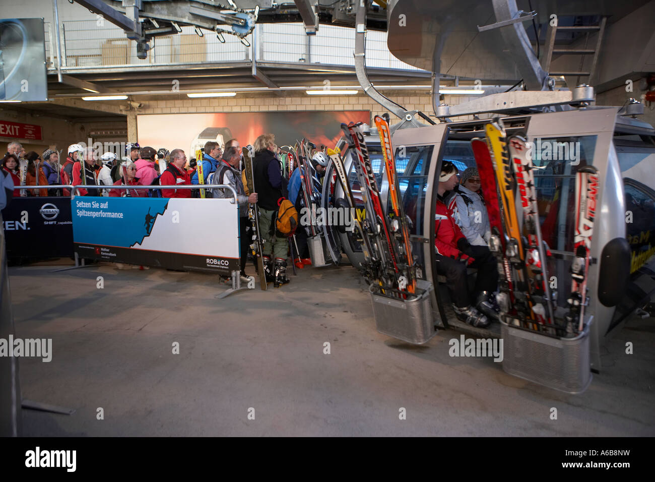 Skiers queueing for the ski lifts in Zermatt Switzerland Europe ...