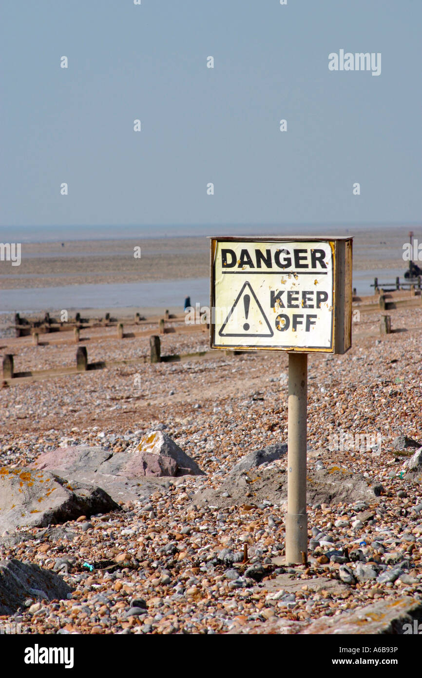 Sign warning of danger on beach on Sussex coast. UK Stock Photo - Alamy