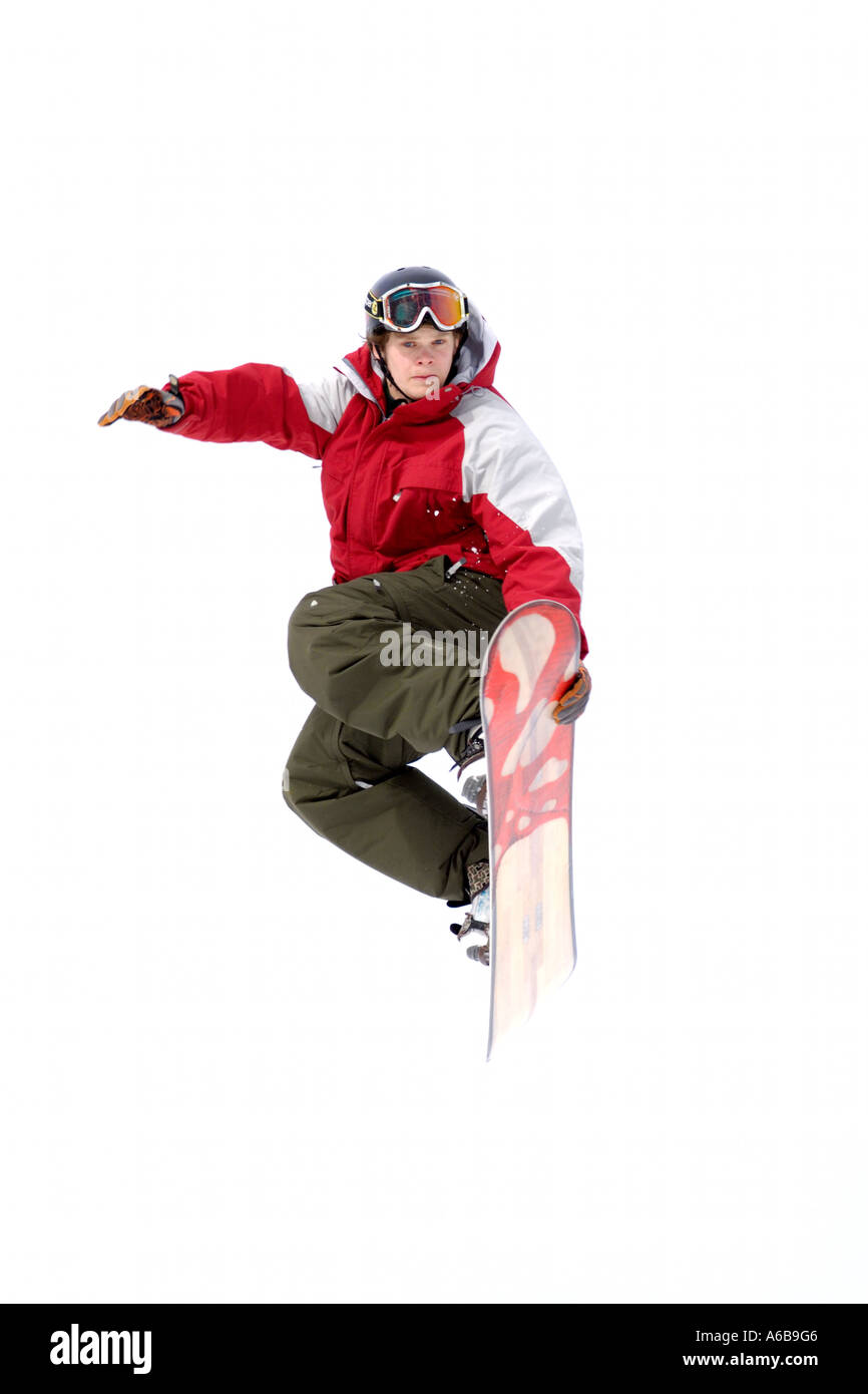 Young snowboarder snowboarding in Cut Out Stock Images & Pictures - Alamy