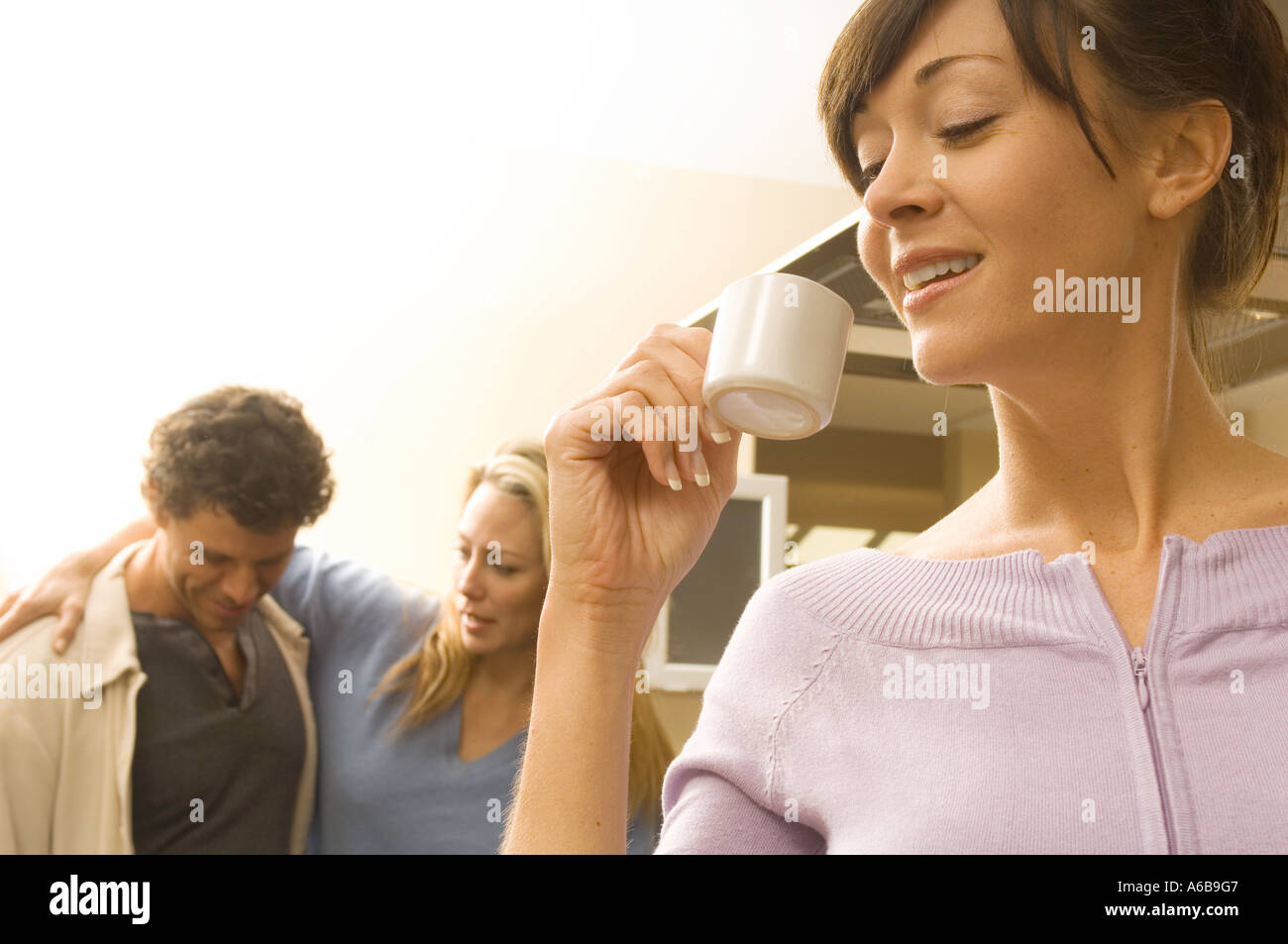 Group of adults drinking coffee Stock Photo - Alamy