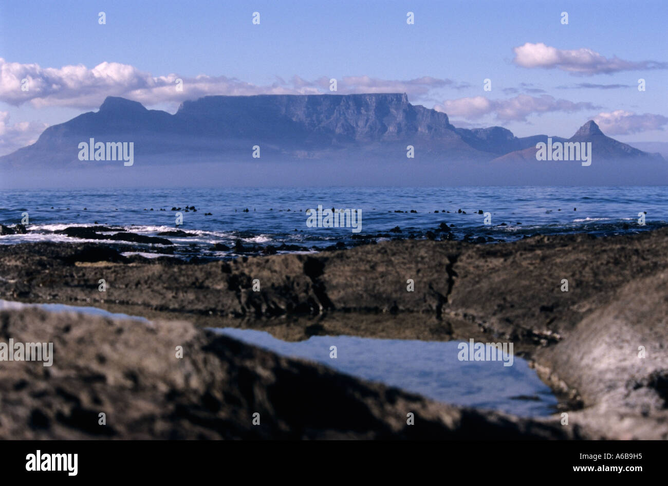 Ocean mist and clouds surrounding Table Mountain iconic landmark of ...