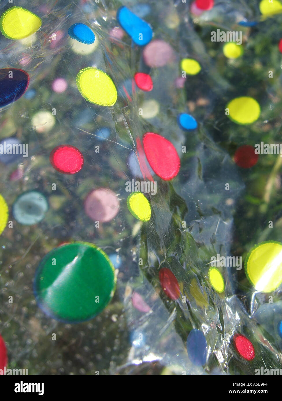 many colourful spots on plastic bag Stock Photo - Alamy