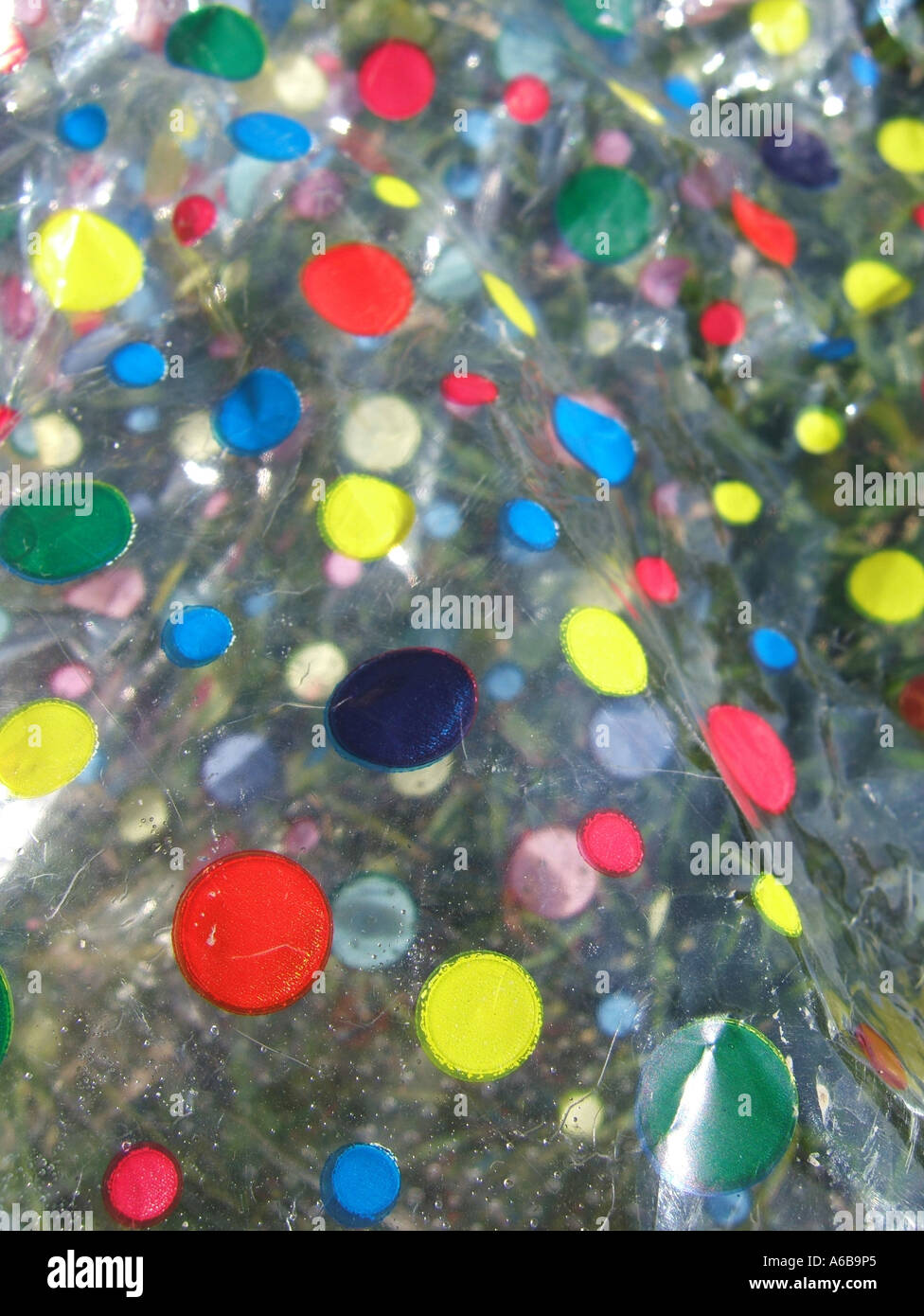 many colourful spots on plastic bag Stock Photo - Alamy