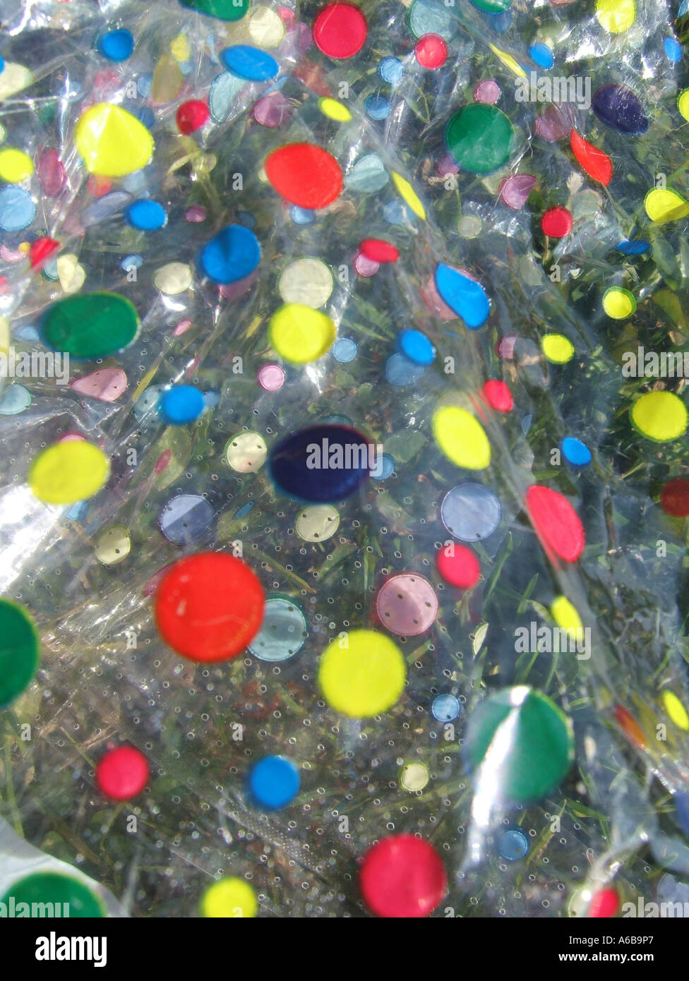 many colourful spots on plastic bag Stock Photo - Alamy