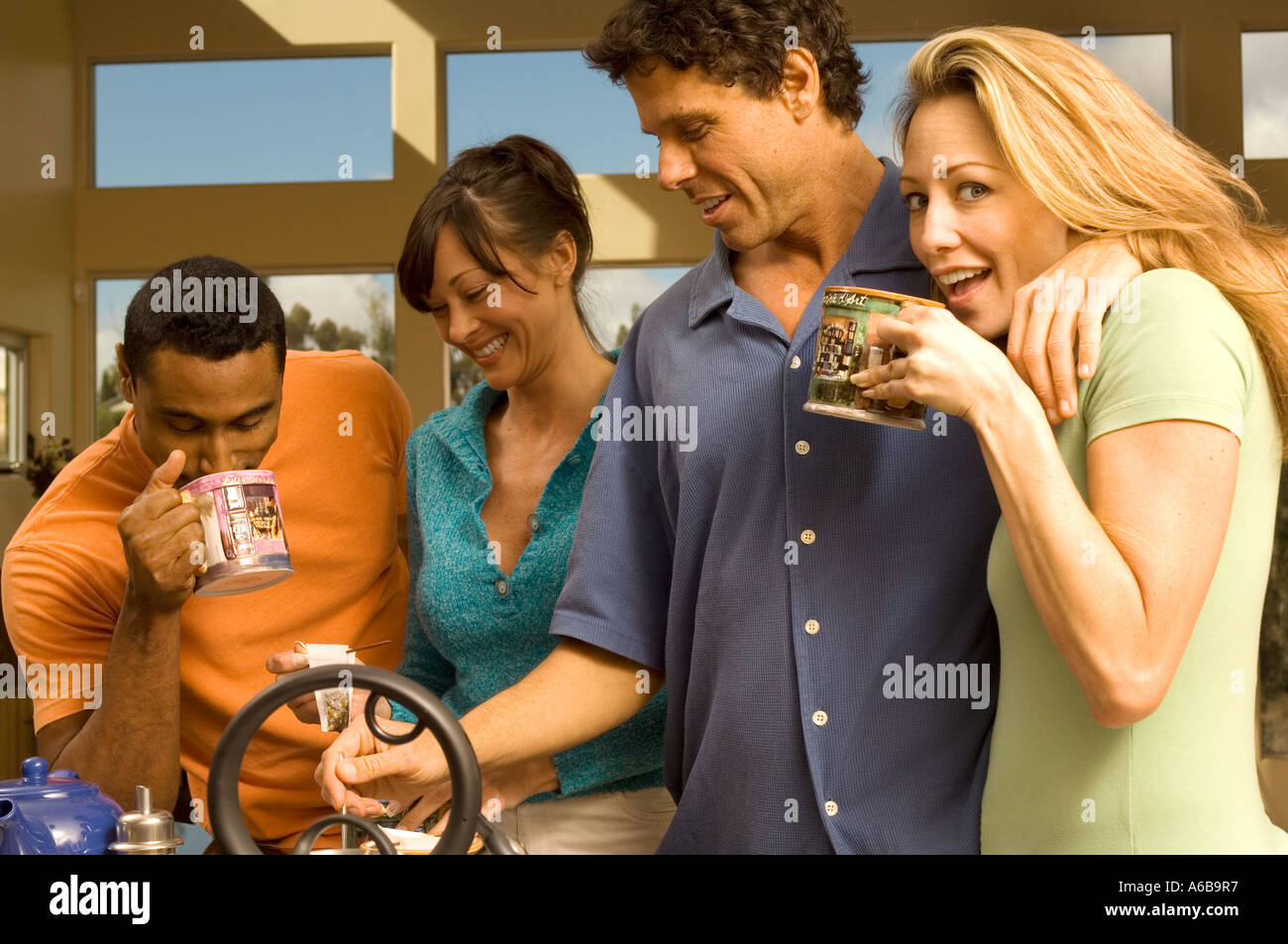 Group of adults drinking coffee Stock Photo - Alamy